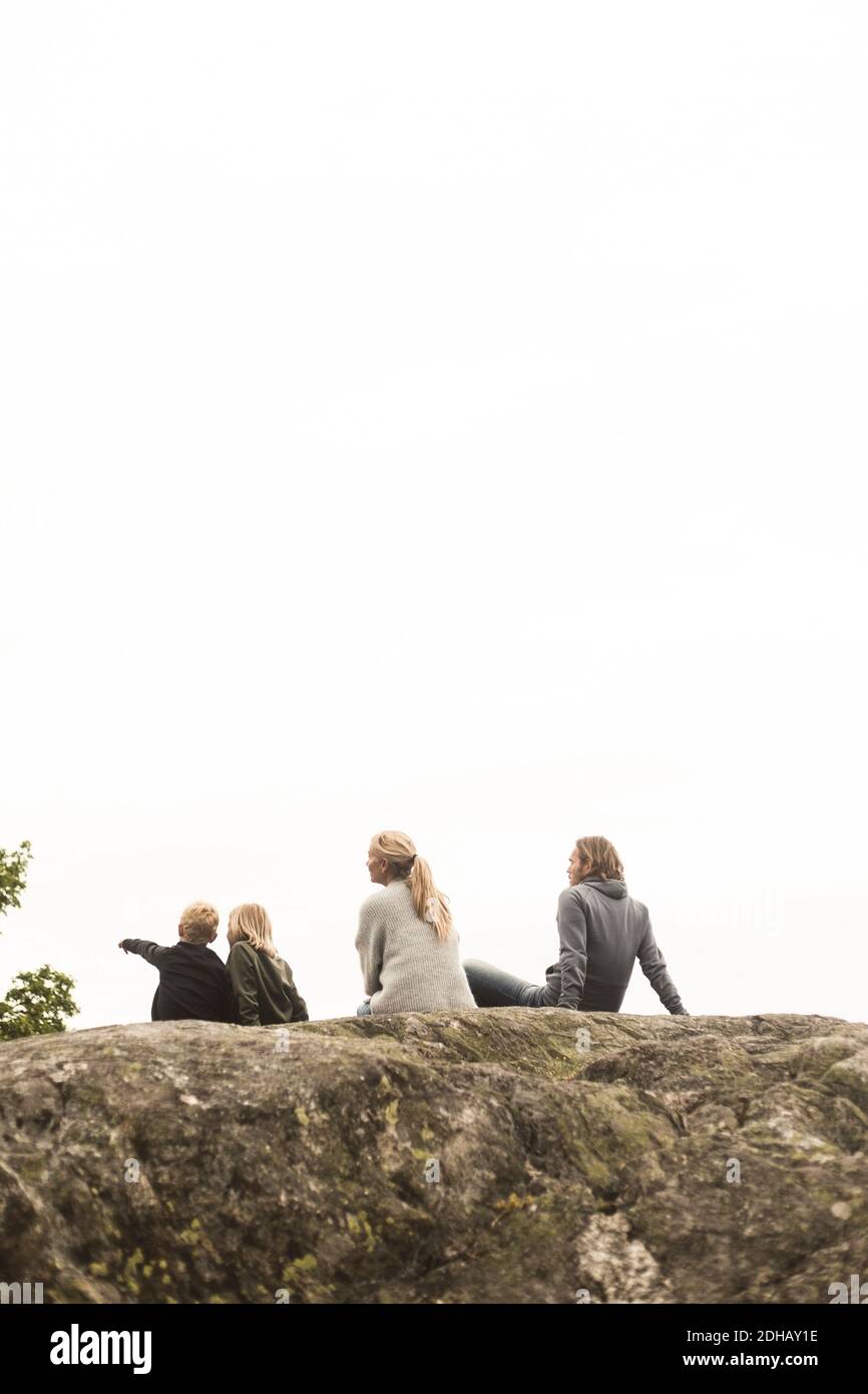 Children sitting on rock hi-res stock photography and images - Alamy