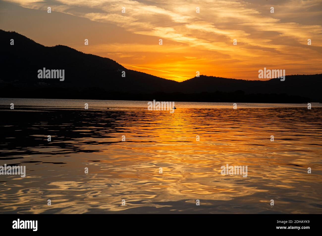 Sunset view of river with mountains in India Stock Photo - Alamy