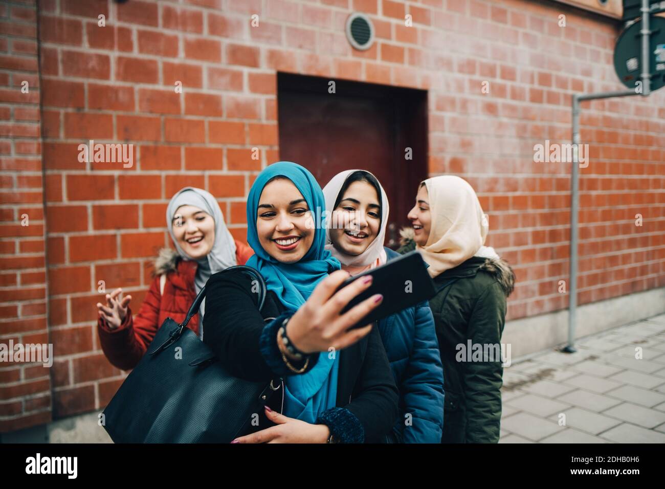 Portrait happy muslim woman using hi-res stock photography and images ...