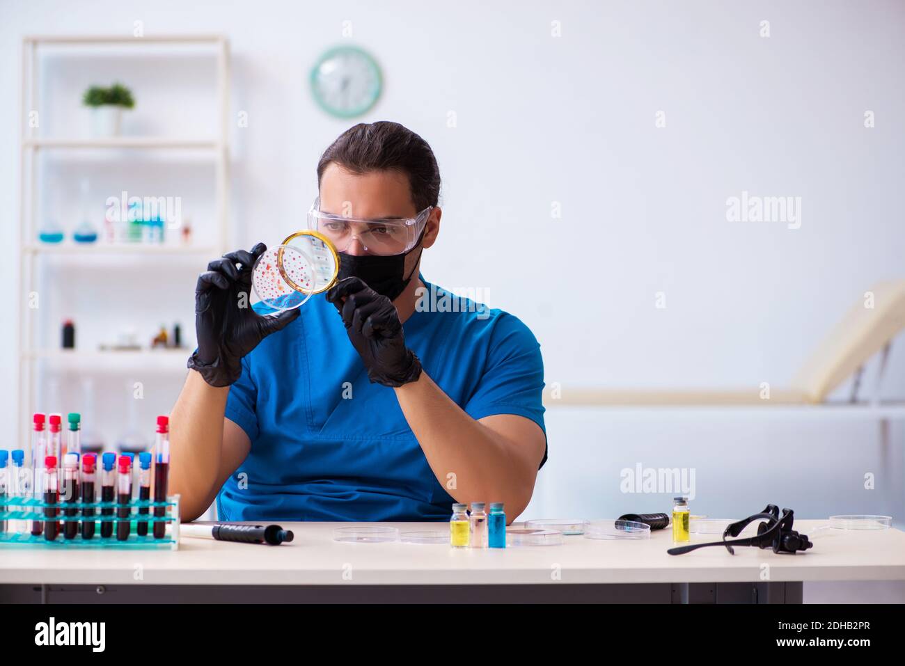 Young biochemist testing blood hi-res stock photography and images - Alamy