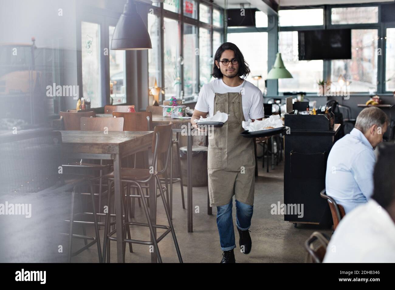 Waiter walking away hi-res stock photography and images - Alamy