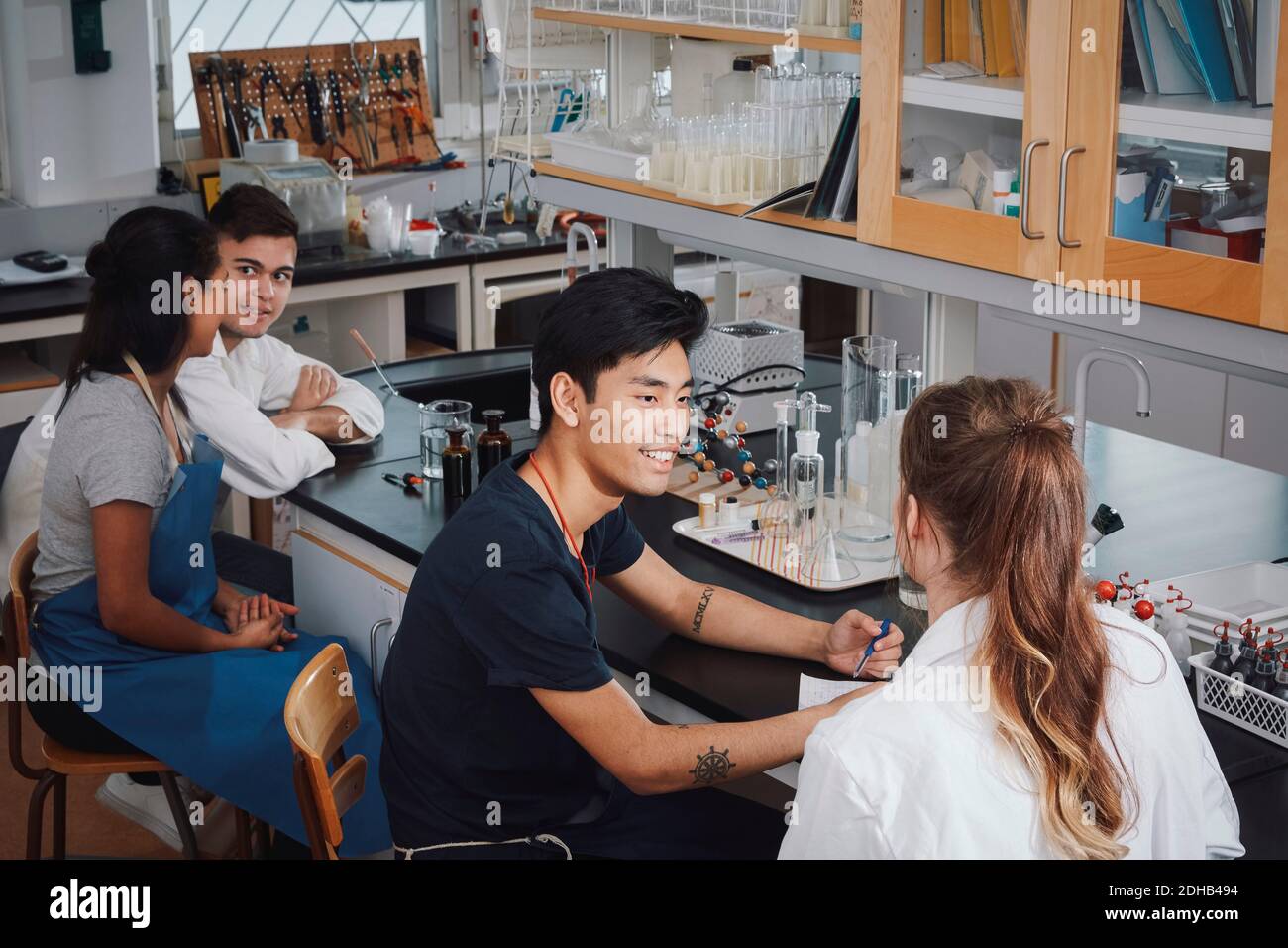 High angle view of multi-ethnic young university students sitting on ...