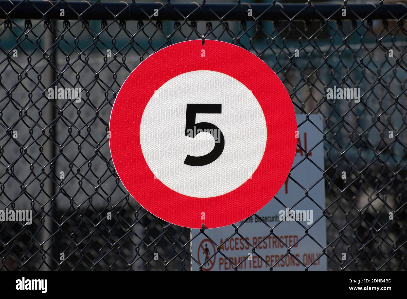 View of round white road sign with red border indicating speed limit of ...