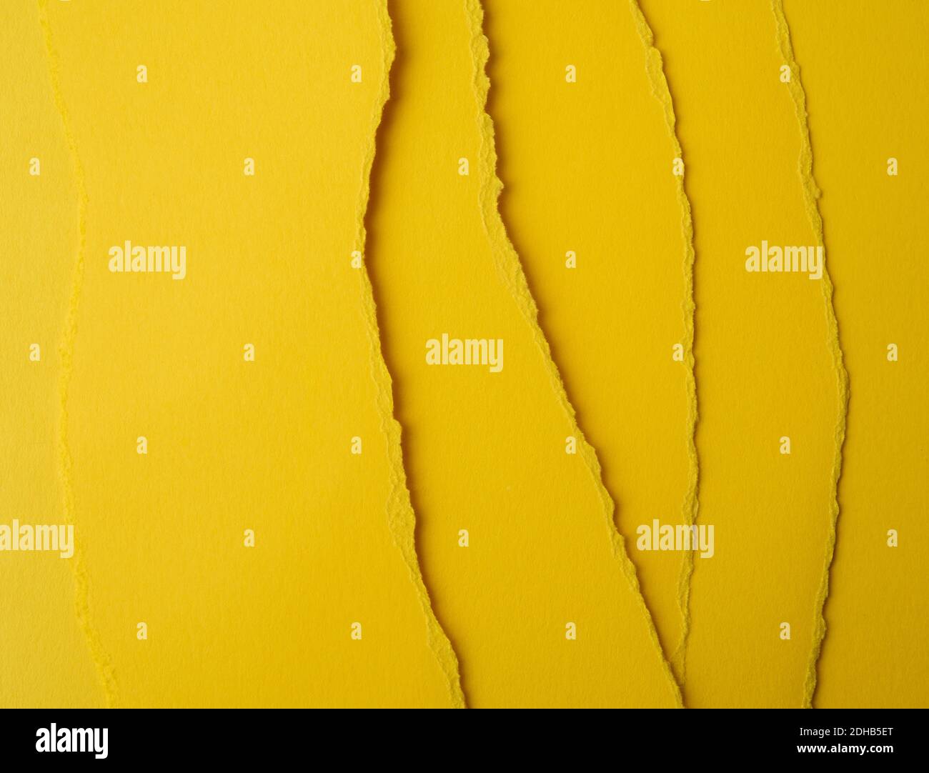 Background of layered yellow torn paper with a shadow Stock Photo - Alamy