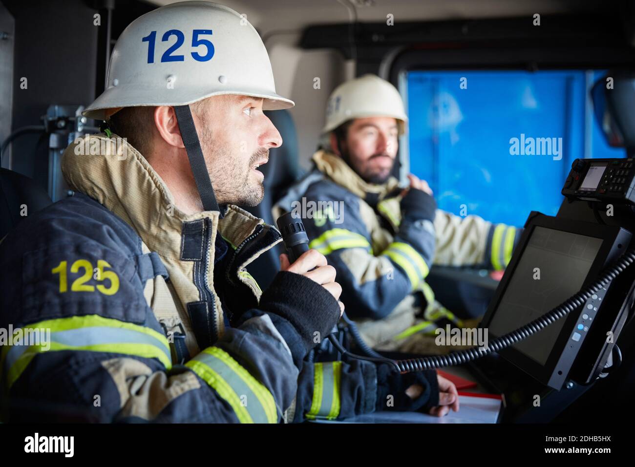 Firefighter talking on microphone hi-res stock photography and images ...