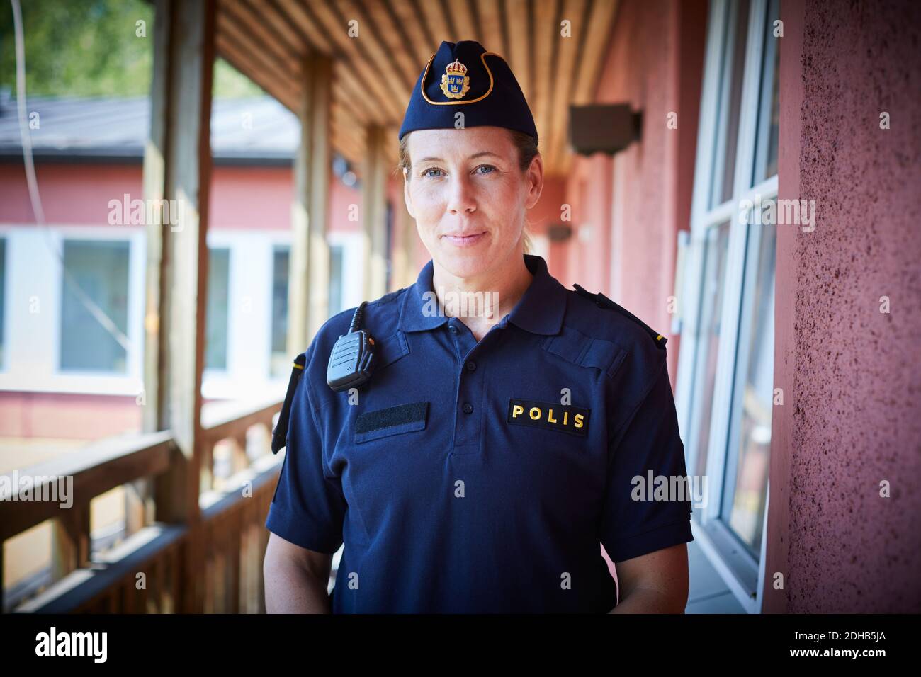 Portrait of policewoman standing in balcony at police station Stock ...