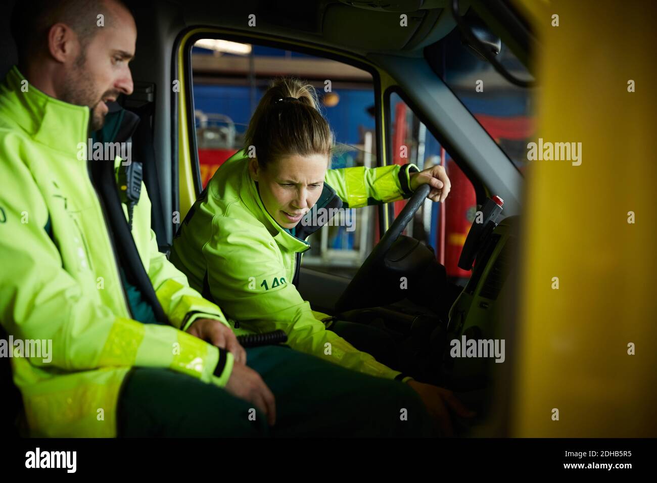 Paramedics talking by ambulance hi-res stock photography and images - Alamy