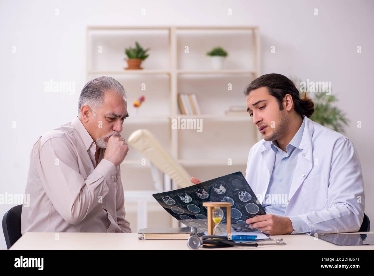 Male patient visiting doctor radiologist in time management conc Stock ...