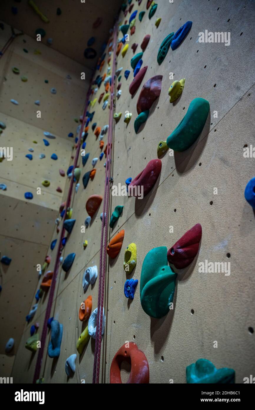 climbing wall with different colored handles in a modern gym Stock ...
