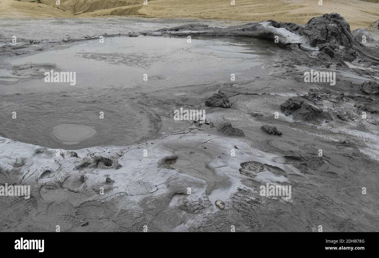 Bubbling crater of a mud volcano. Close up view onto gas bubble ...