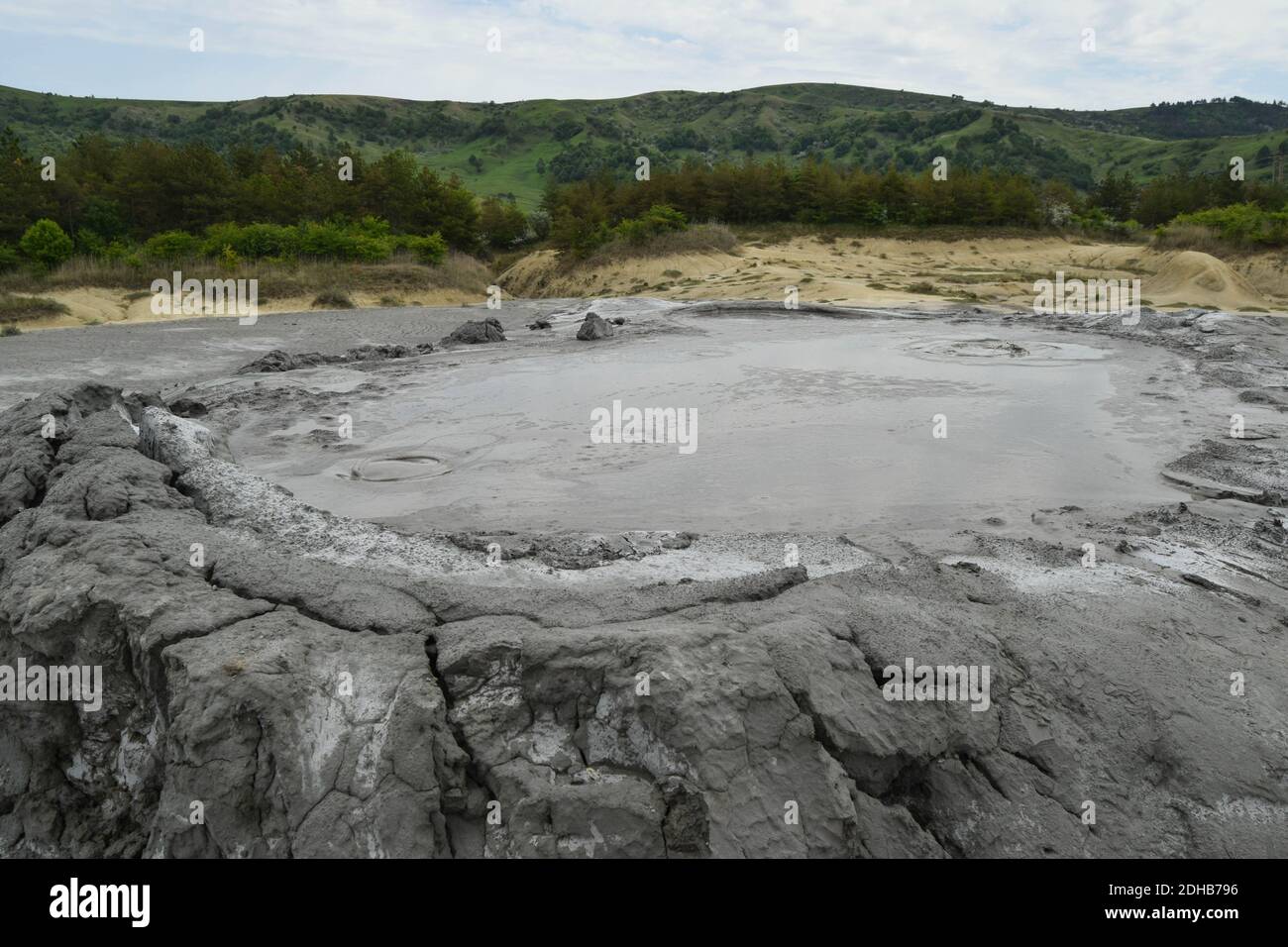 Bubbling crater of a mud volcano. Close up view onto gas bubble ...