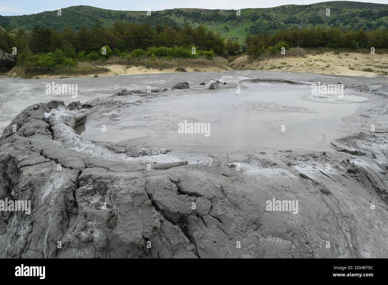 Bubbling crater of a mud volcano. Close up view onto gas bubble ...
