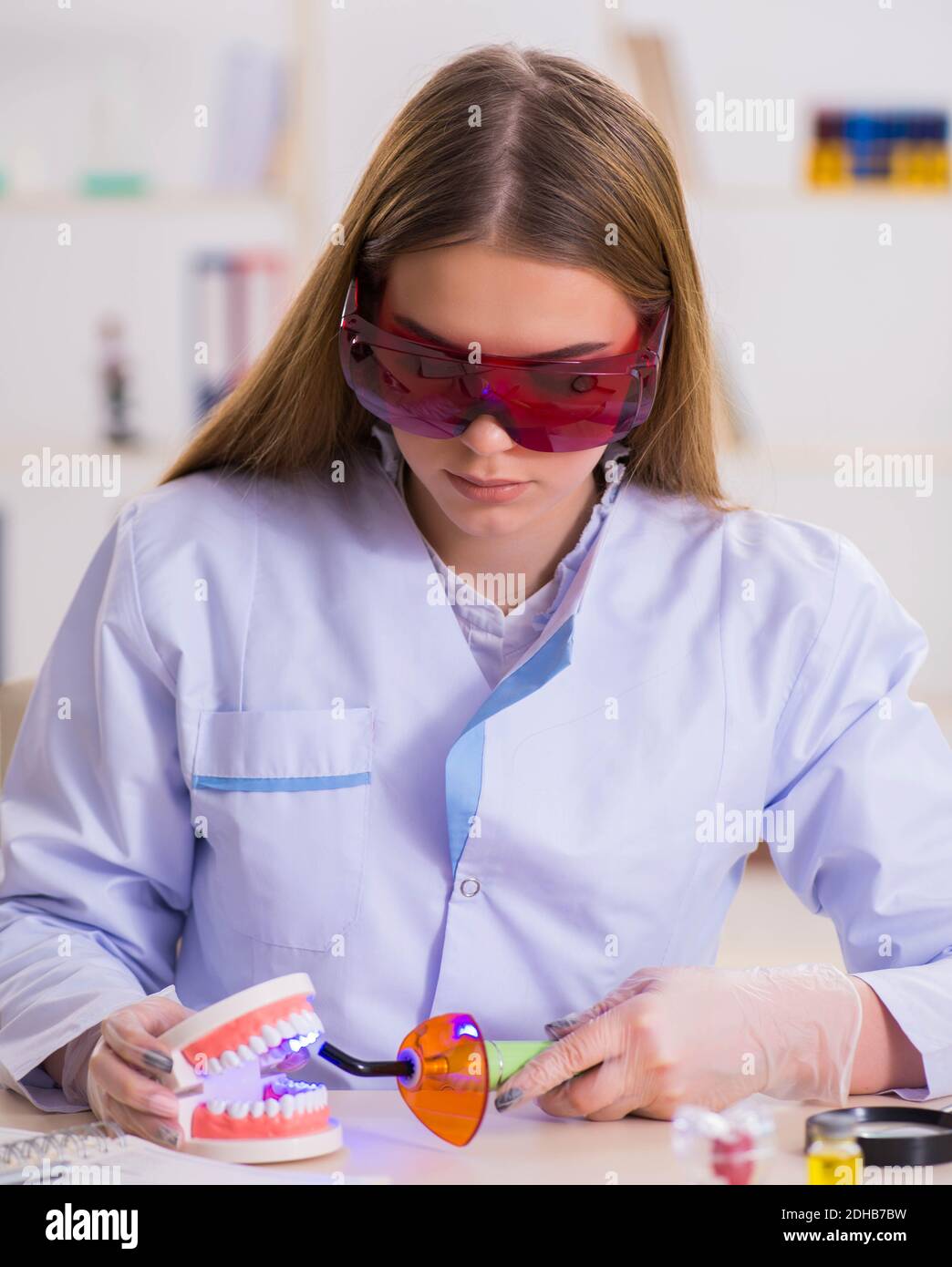 Dentistry student practicing skills in classroom Stock Photo - Alamy