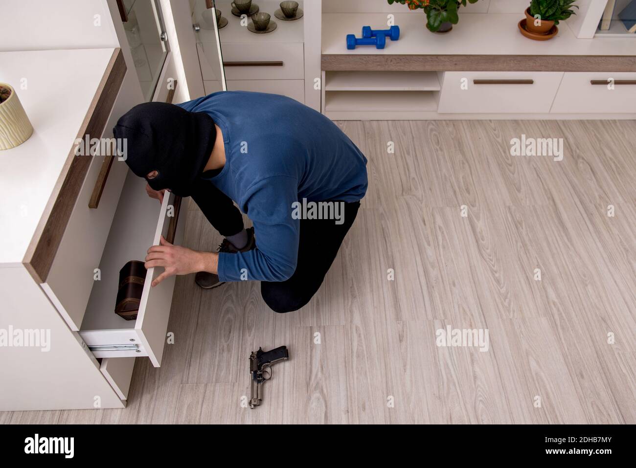 Camera view of male robber stealing things Stock Photo - Alamy