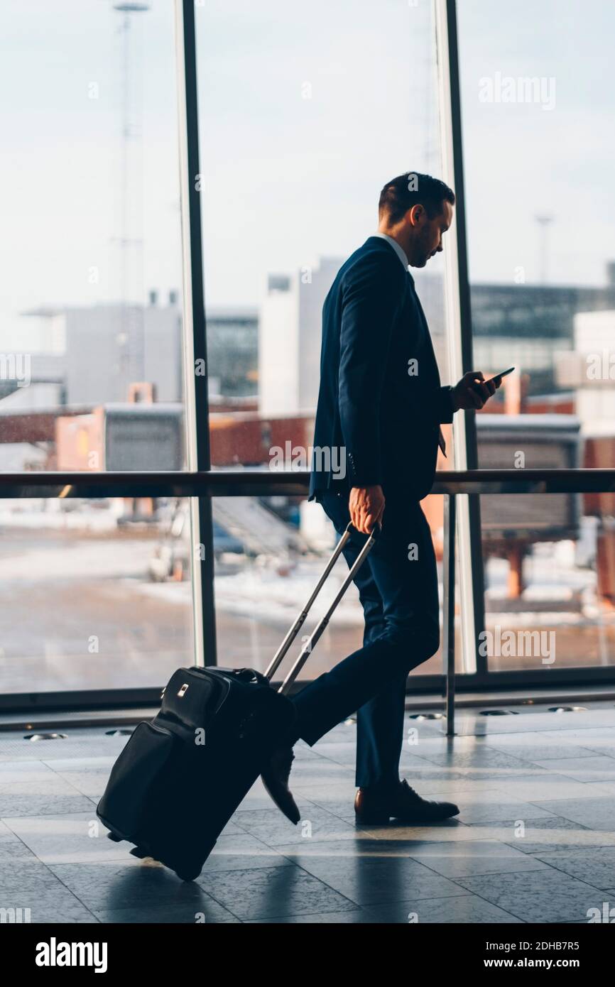Businessman Walking Luggage Side View High Resolution Stock Photography ...