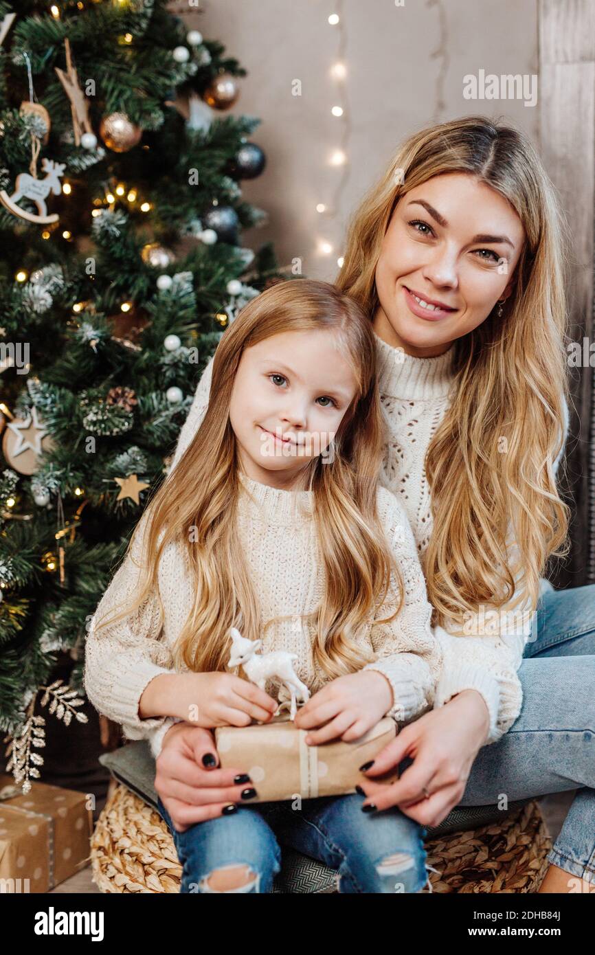 happy family open presents on Christmas morning near tree Stock Photo ...