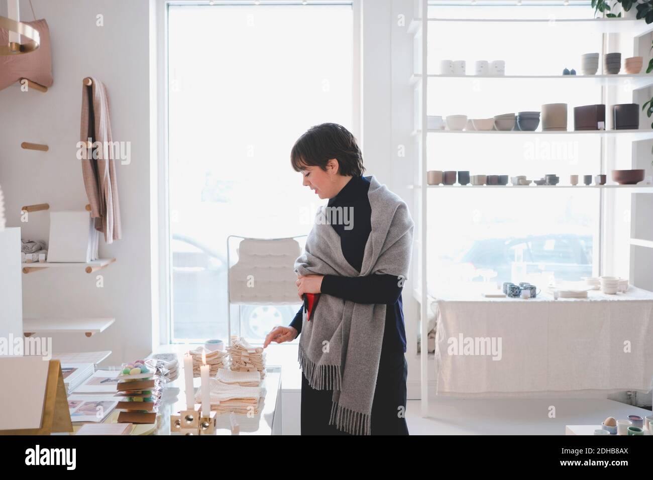 Young female customer examining swatches in store Stock Photo - Alamy