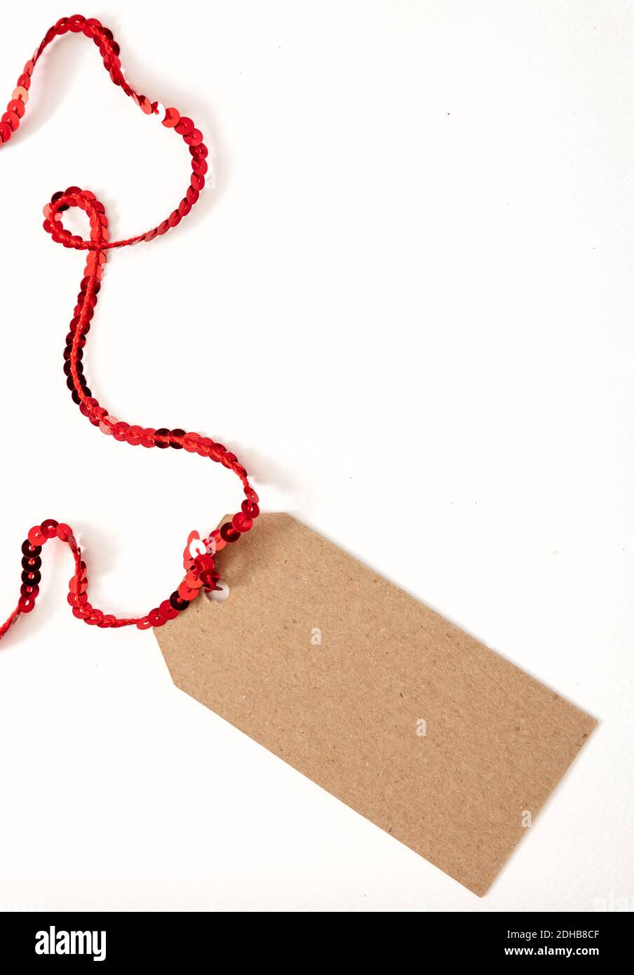 Blank brown carton paper gift tag, Cardboard label isolated on white ...