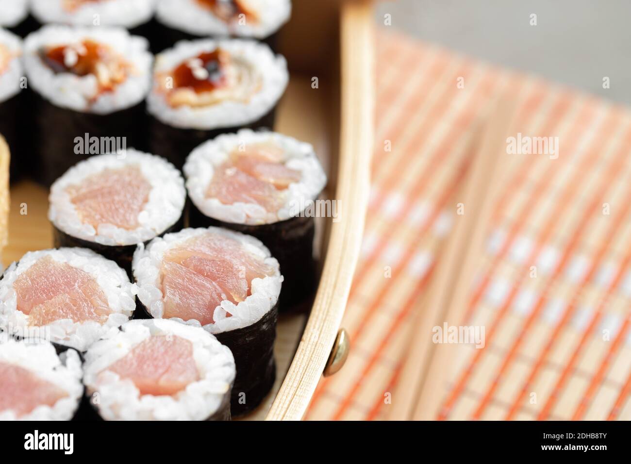 Set of maki sushi on wooden boat tray Stock Photo - Alamy