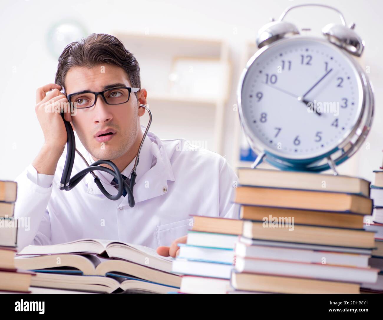 Medical student running out of time for exams Stock Photo - Alamy