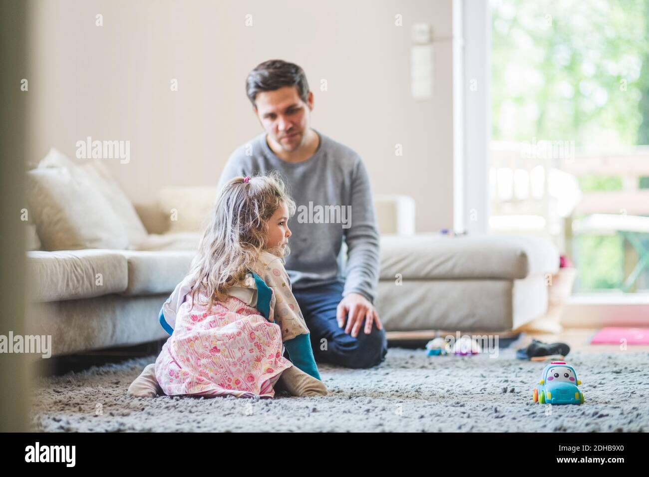 Child kneeling rear view hi-res stock photography and images - Alamy
