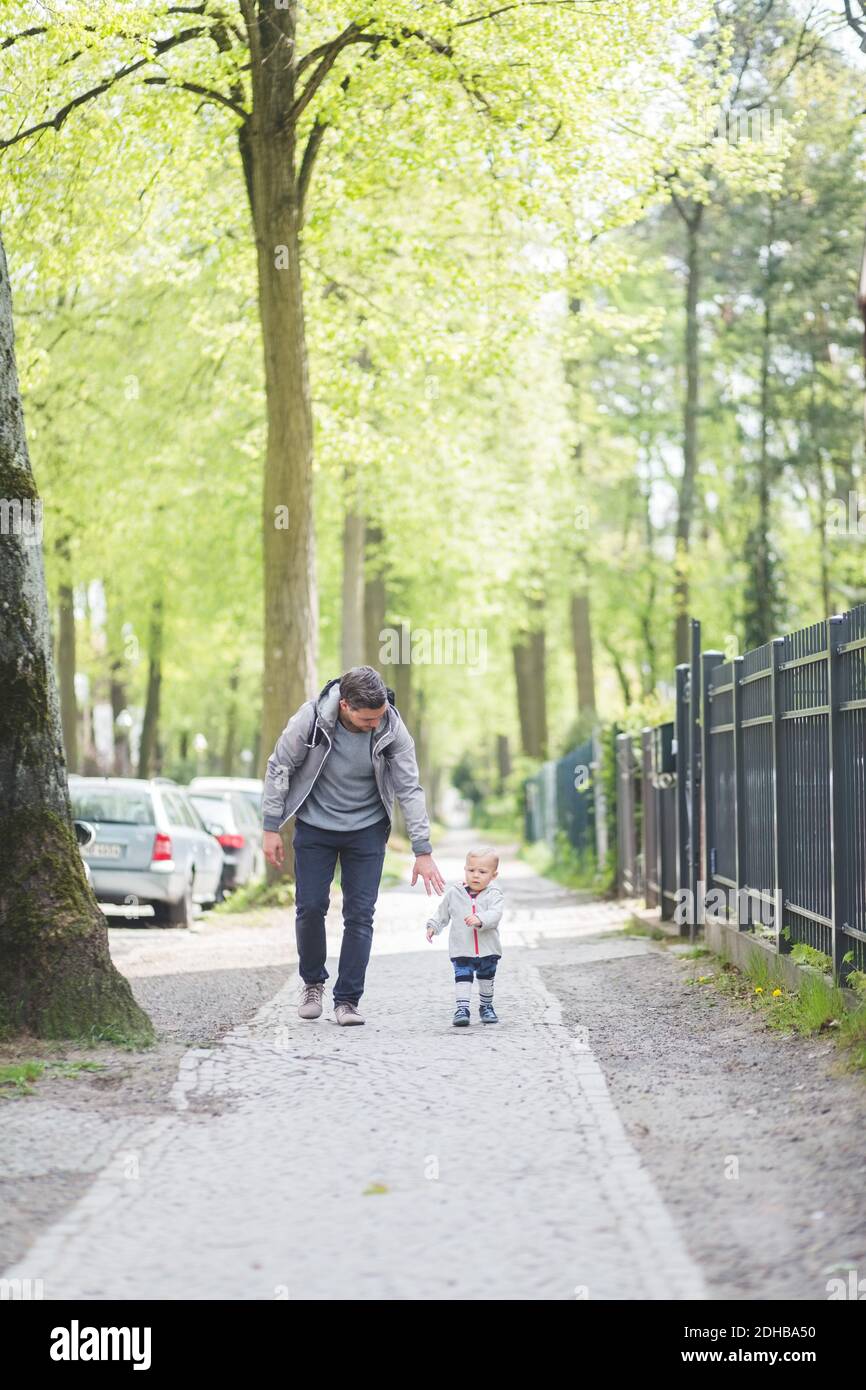 Father and son walking hi-res stock photography and images - Alamy