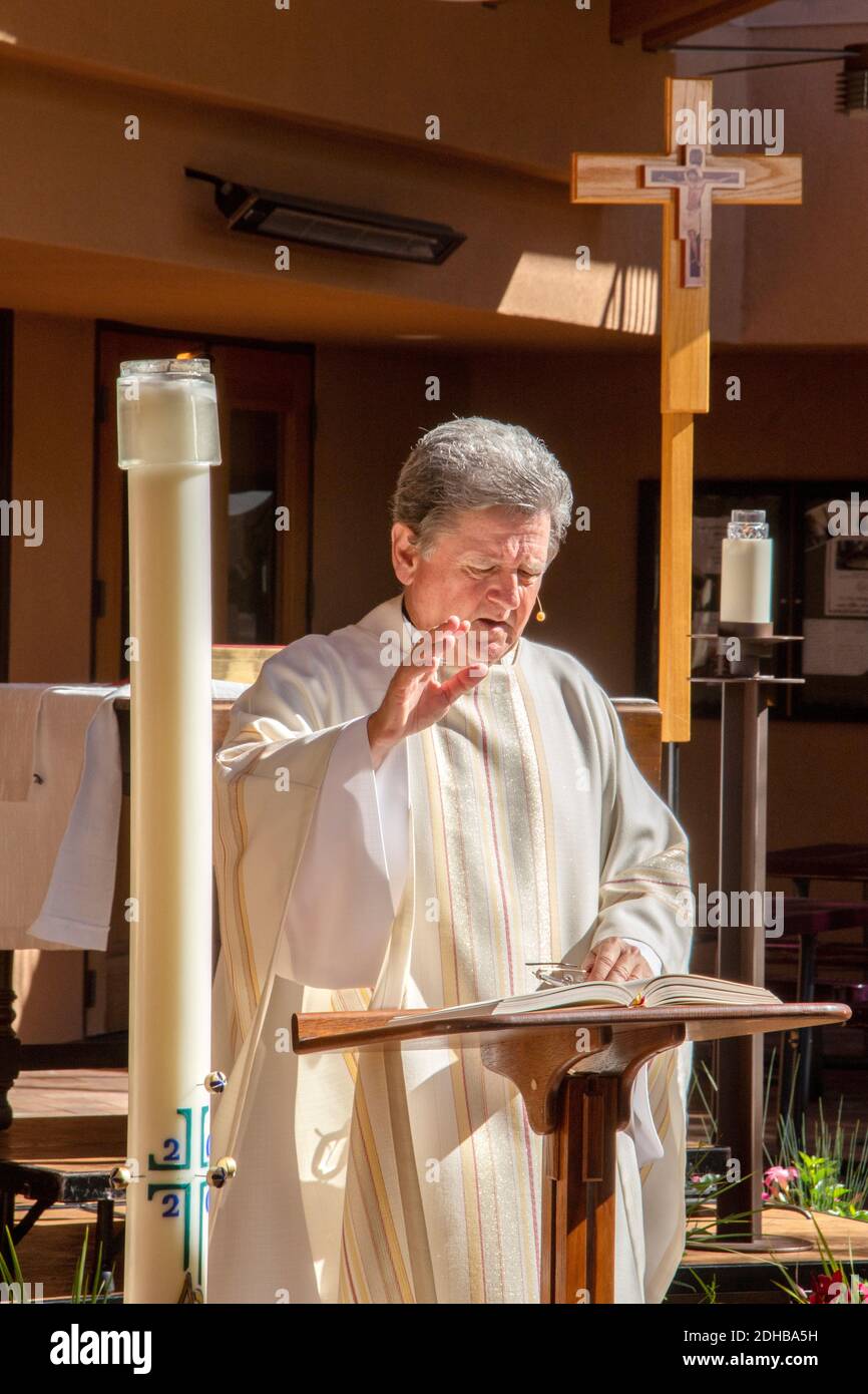 The monsignor of a Southern California Catholic church conducts an ...