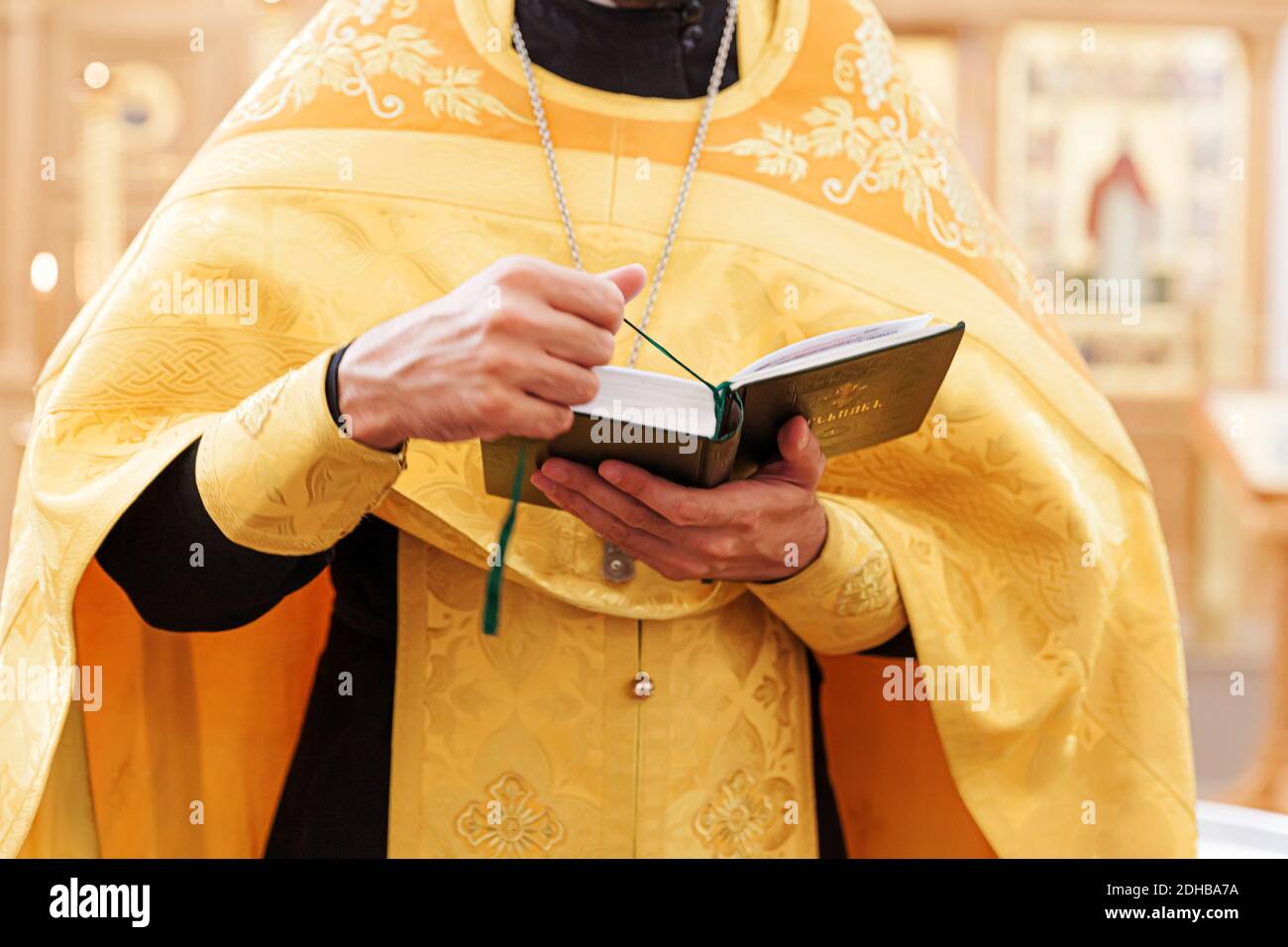 Orthodox Church. Christianity. Priest hands holding Holy Bible book in ...