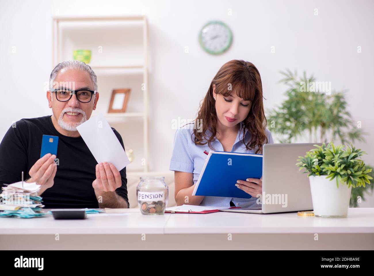 Financial advisor giving retirement advice to old man Stock Photo - Alamy