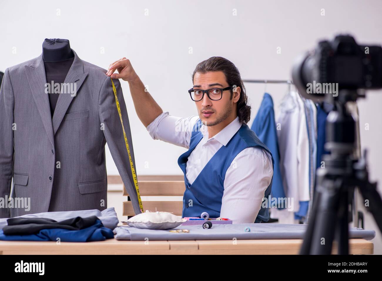 Male tailor taking measurements hi-res stock photography and images - Alamy