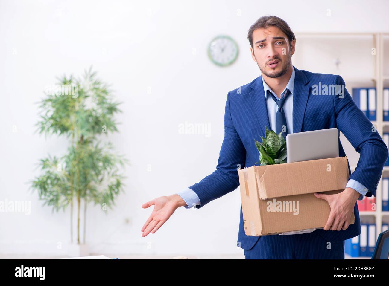 Young man being fired from his work Stock Photo - Alamy