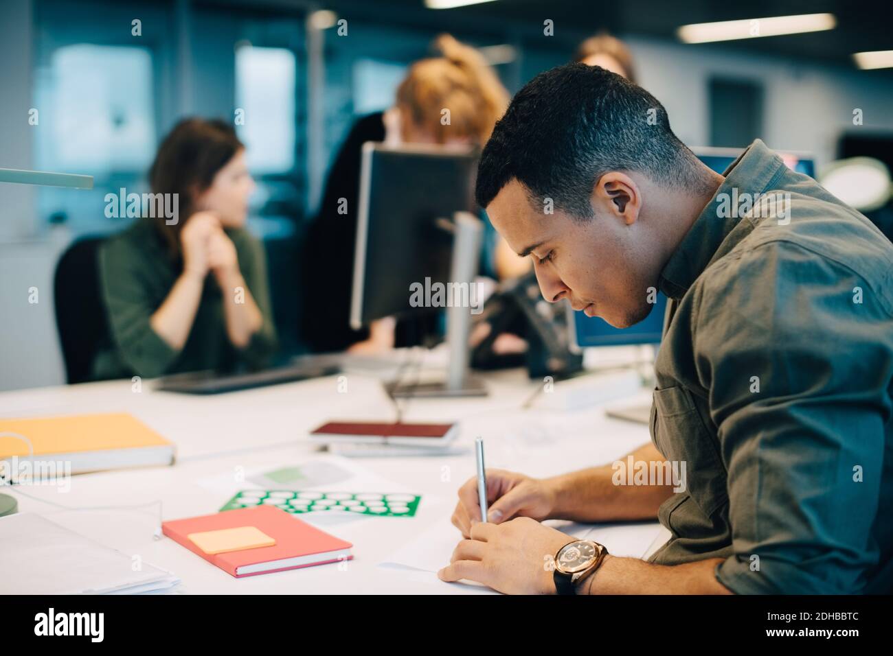 Business colleague writing on paper hi-res stock photography and images ...