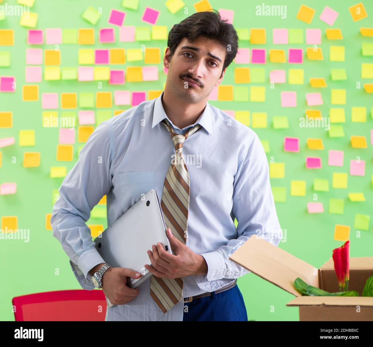 Man collecting his stuff after redundancy in the office with man Stock ...