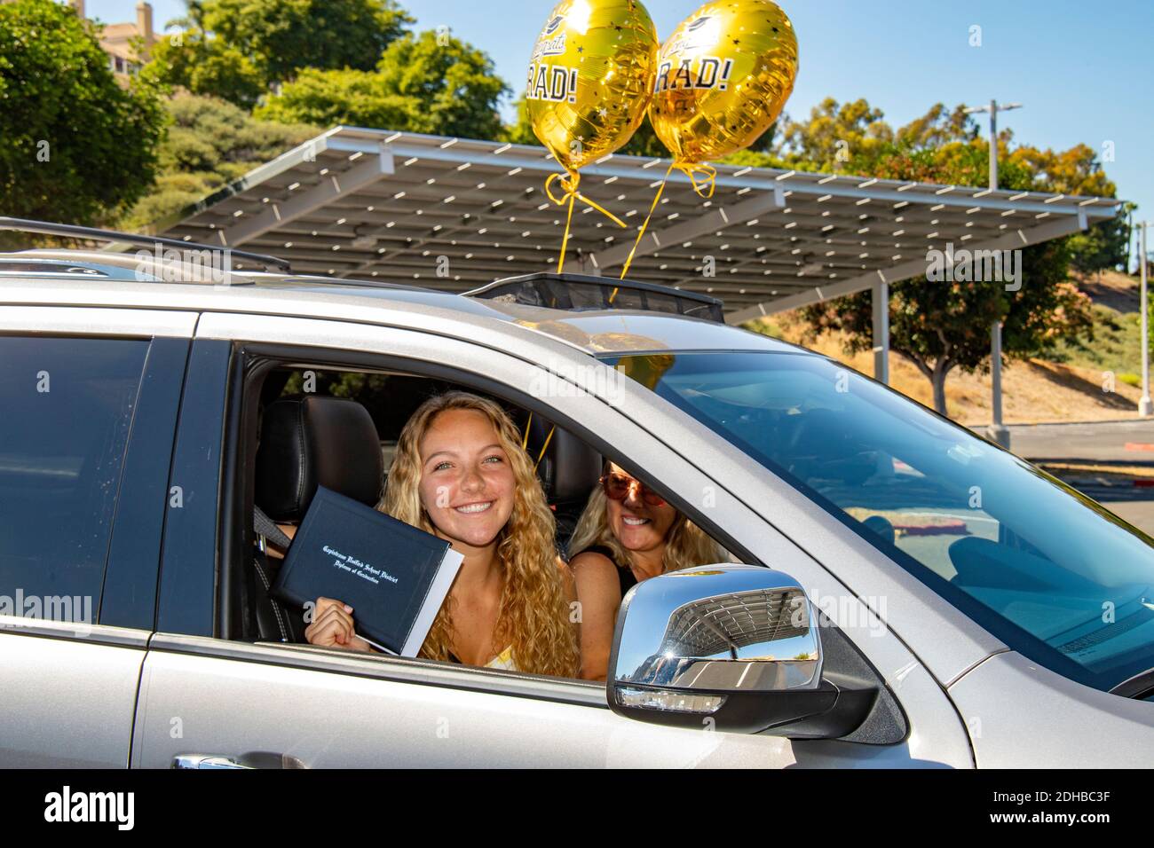 A happy Southern California high school senior receives her diploma at ...
