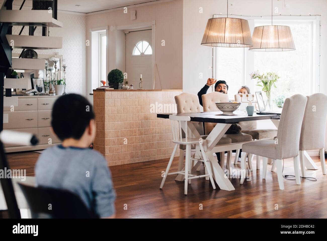 Child hiding at home behind chairs hi-res stock photography and images ...