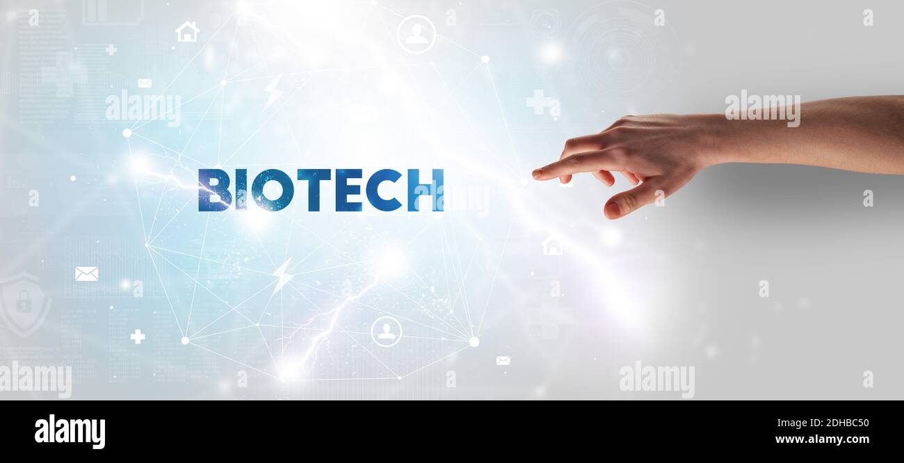 Hand pointing at BIOTECH inscription, modern technology concept Stock ...