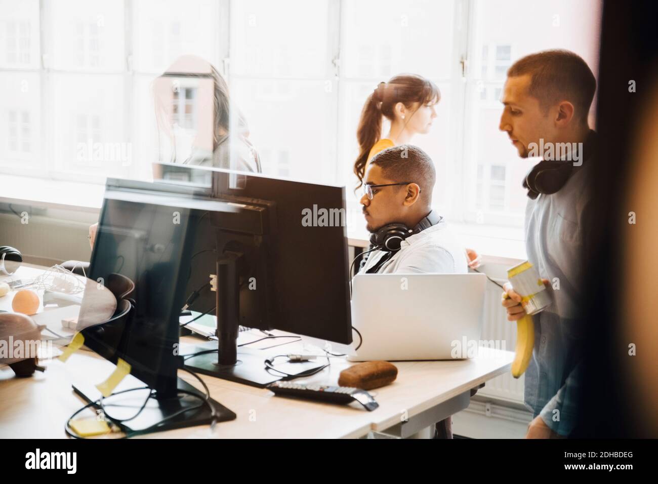 Male and female programmers working at creative office Stock Photo - Alamy