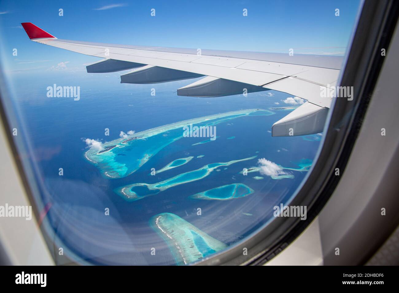 Airplane interior with window view of Maldives island. Concept of ...