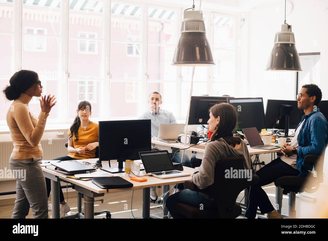 Computer programmer gesturing discussing hi-res stock photography and ...