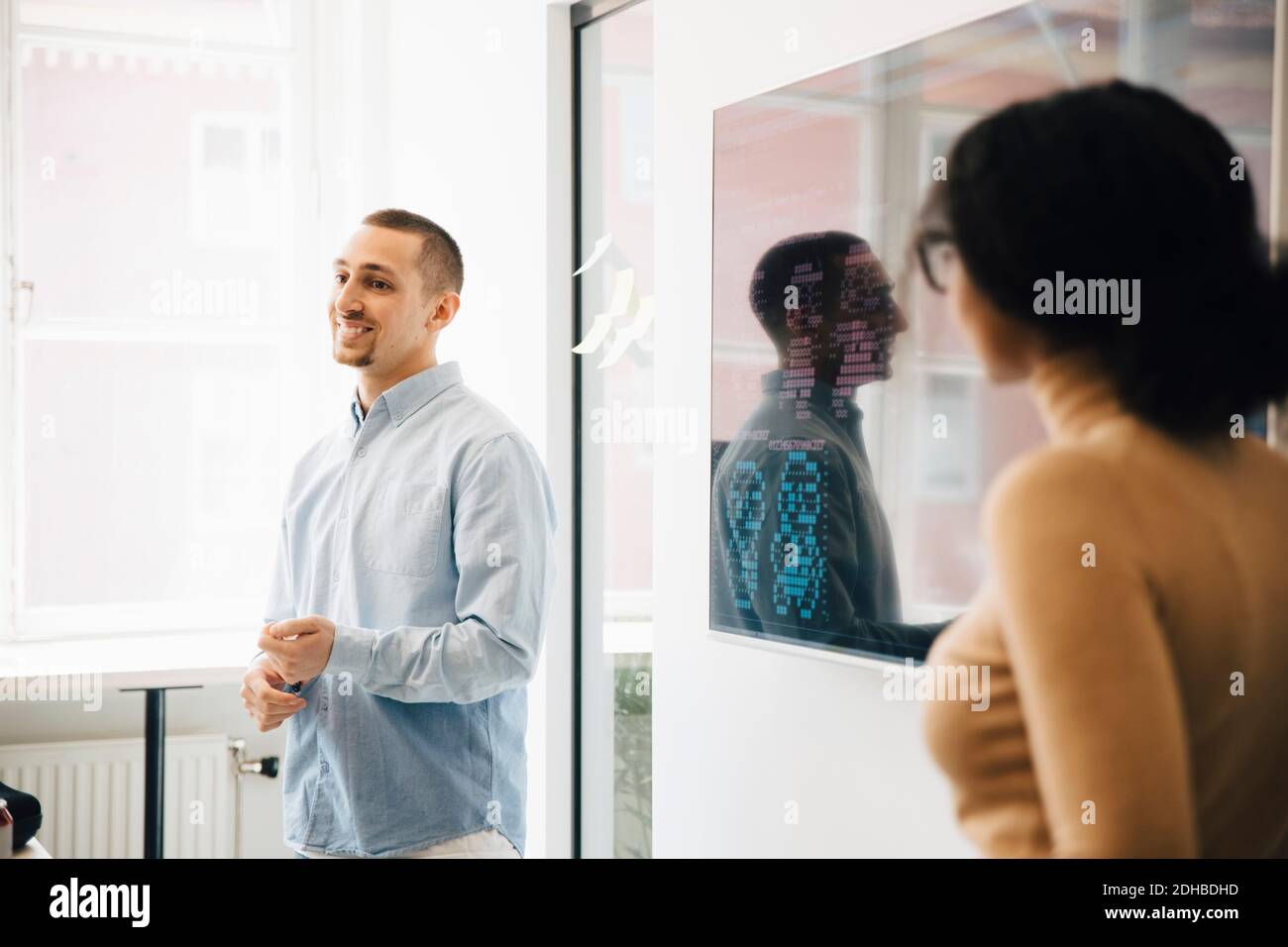 Computer programmers giving presentation over code during meeting Stock ...