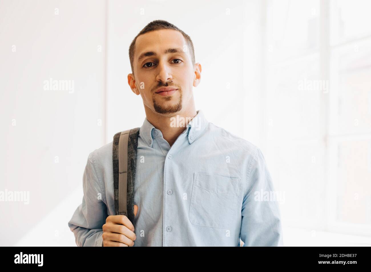 Portrait of hacker standing in office Stock Photo - Alamy