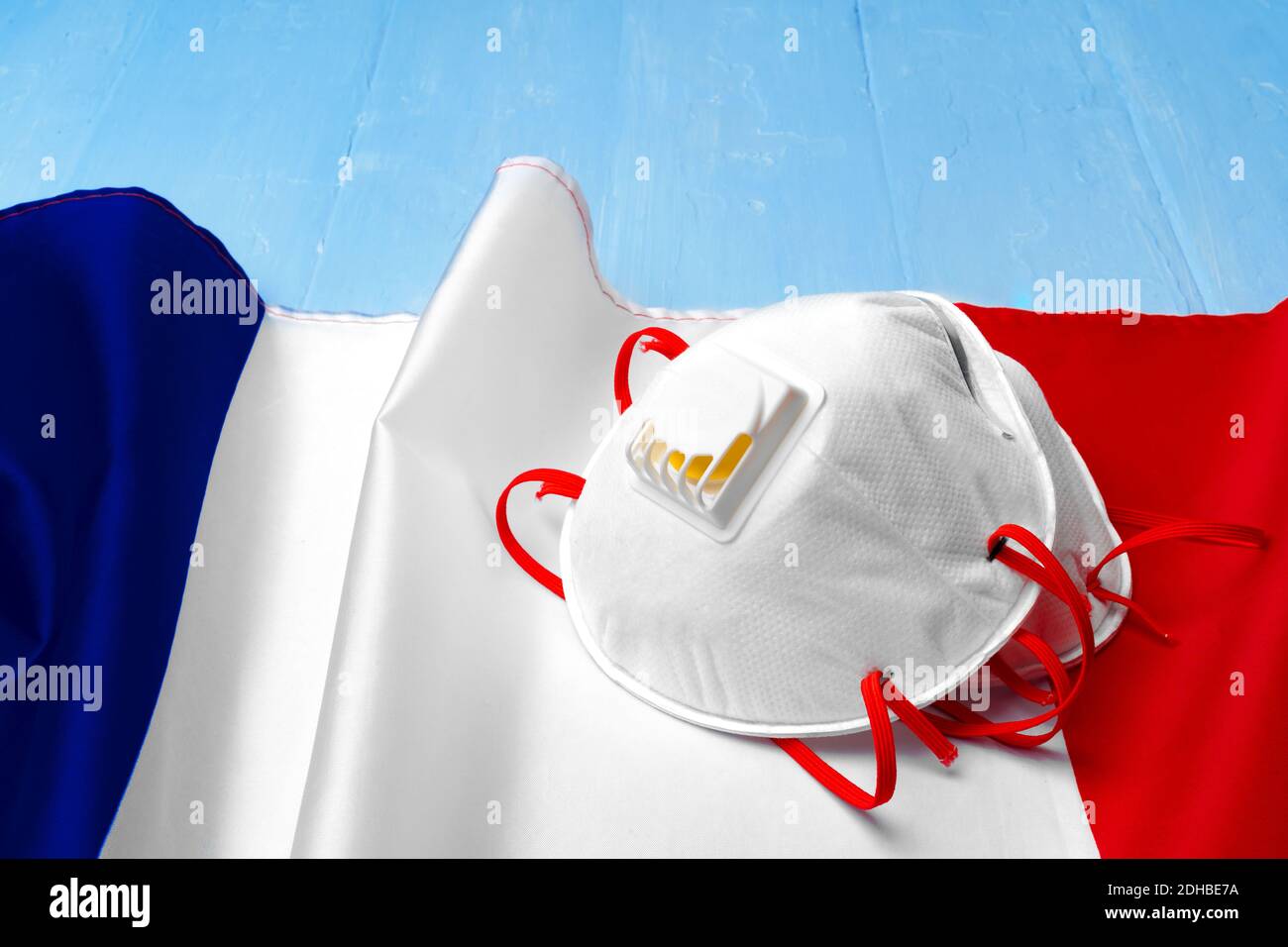 Medical mask on national flag of France Stock Photo - Alamy