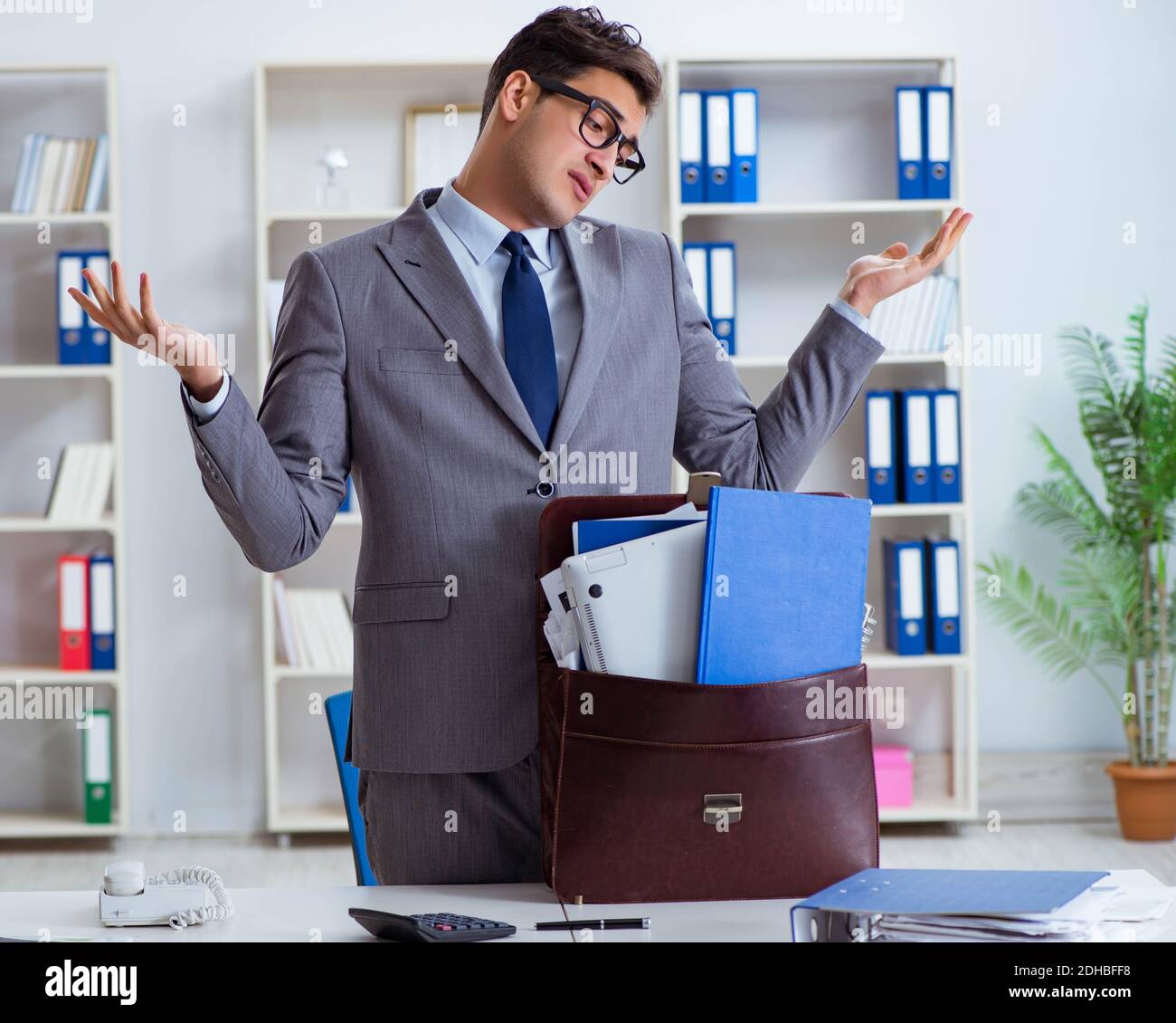 Employee with too much work taking it home Stock Photo - Alamy