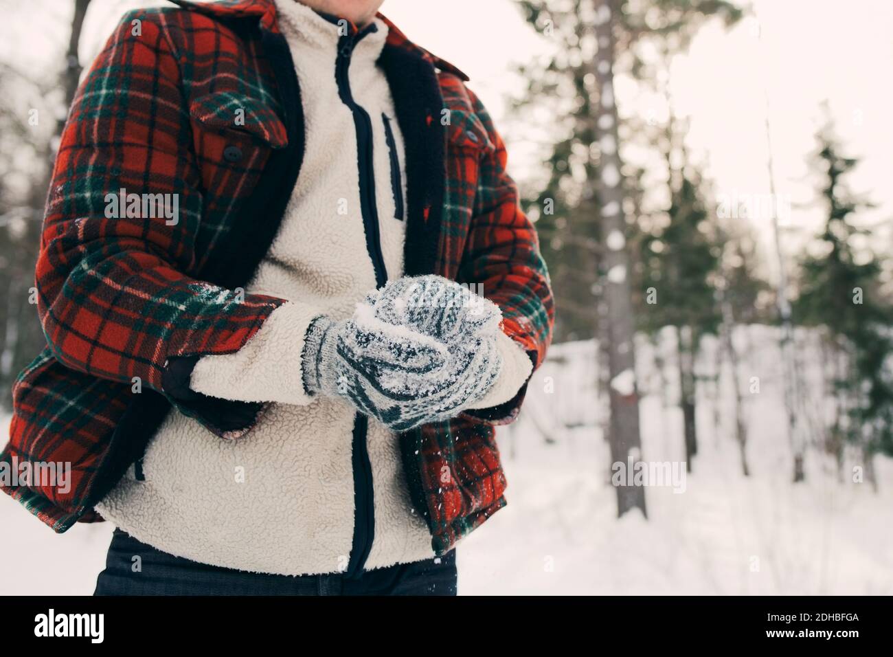 Man making snowball hi-res stock photography and images - Alamy