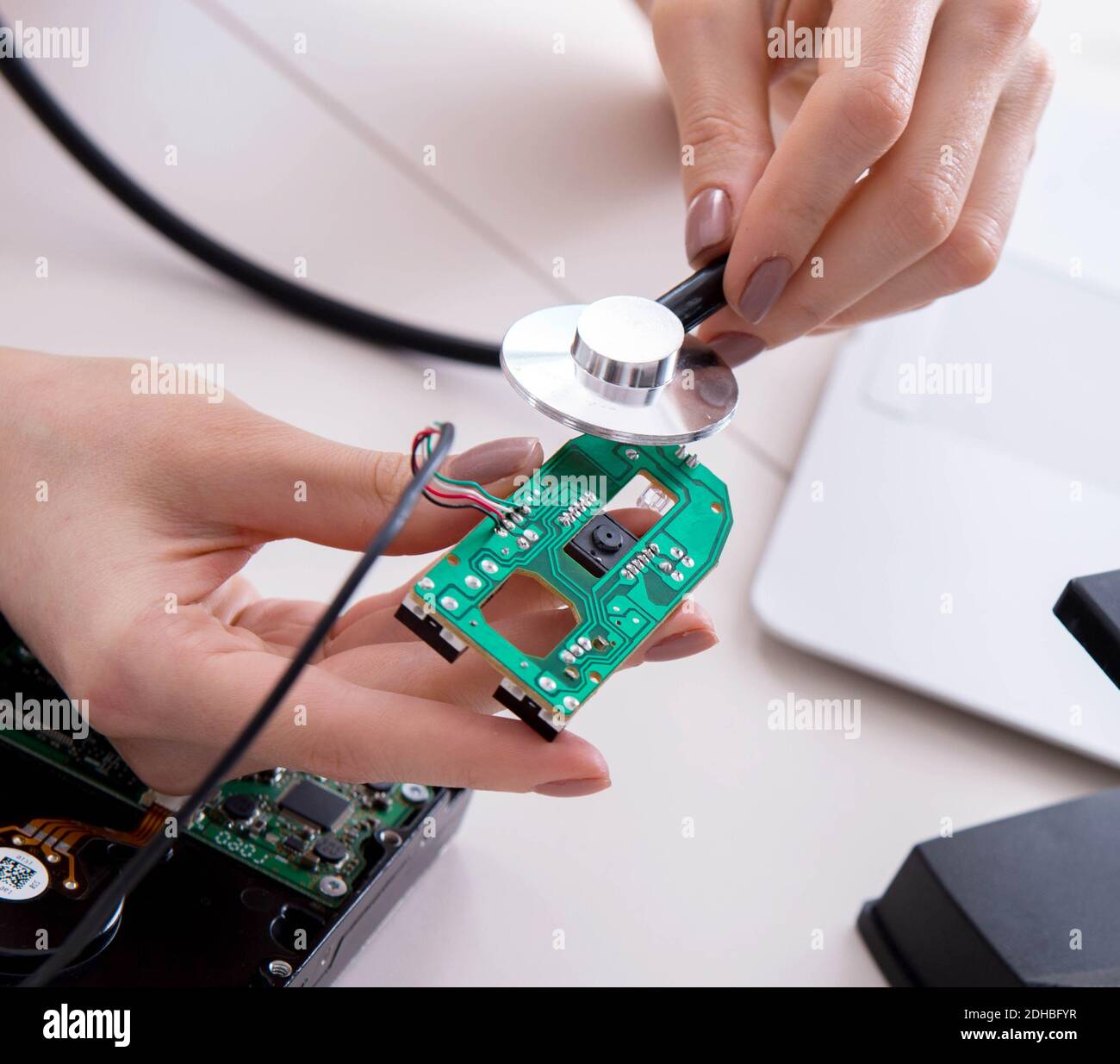 Engineer fixing broken computer hard drive Stock Photo - Alamy