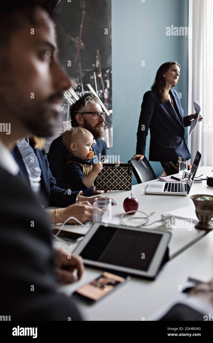 Business people concentrating during meeting in board room Stock Photo ...