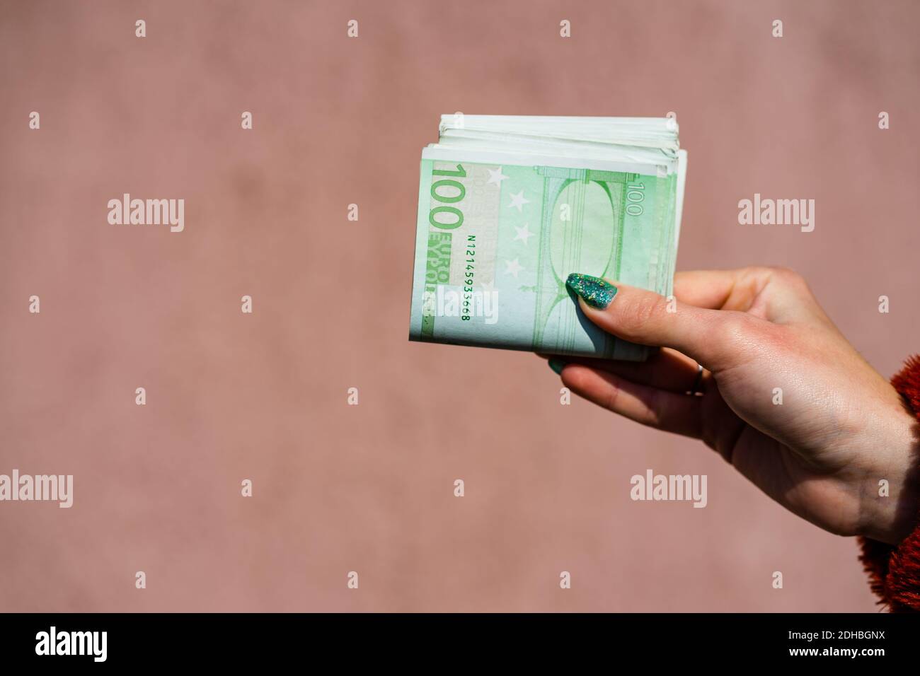 Hand holding and showing euro money or giving money. World money ...