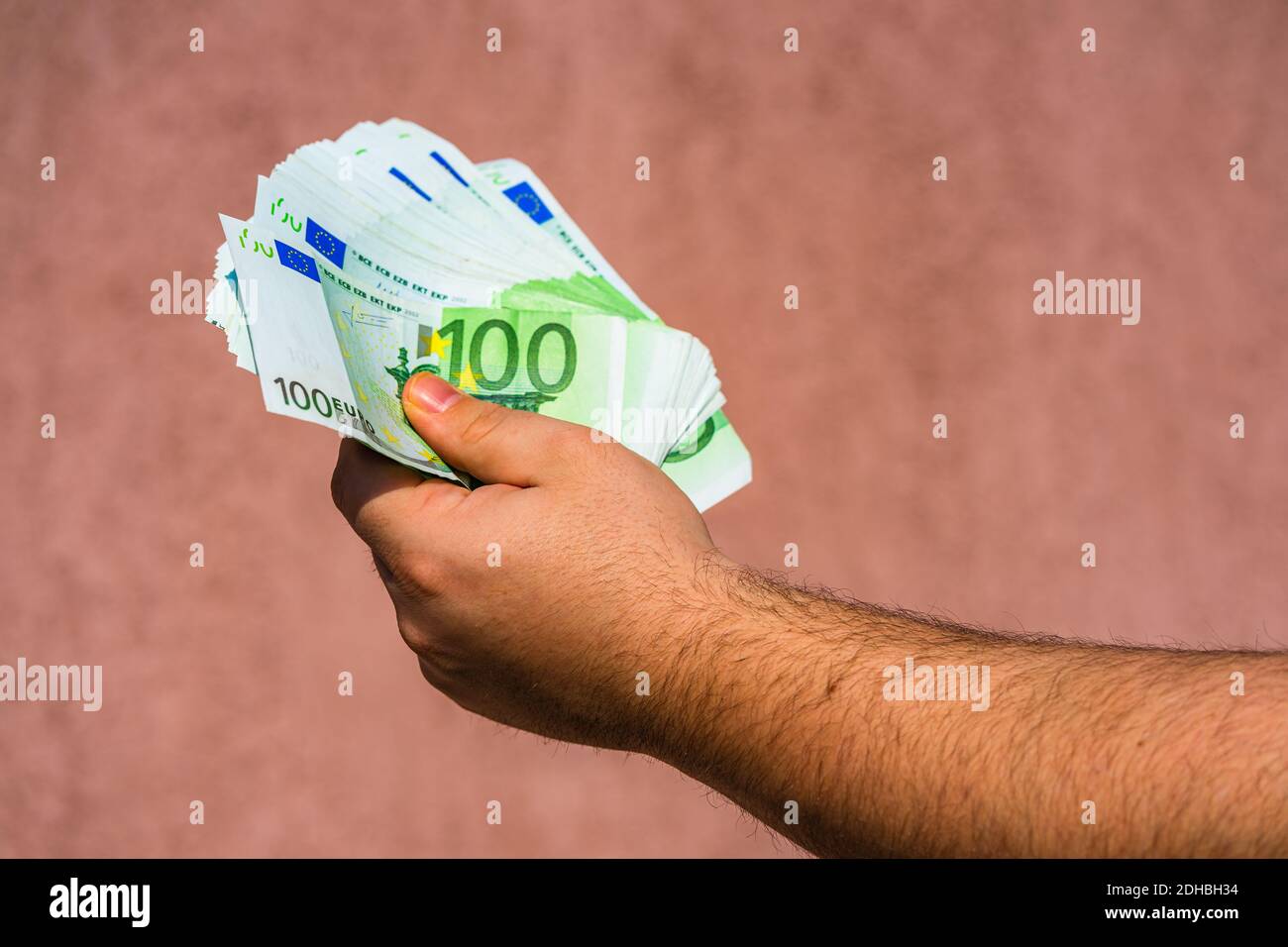 Hand holding and showing euro money or giving money. World money ...
