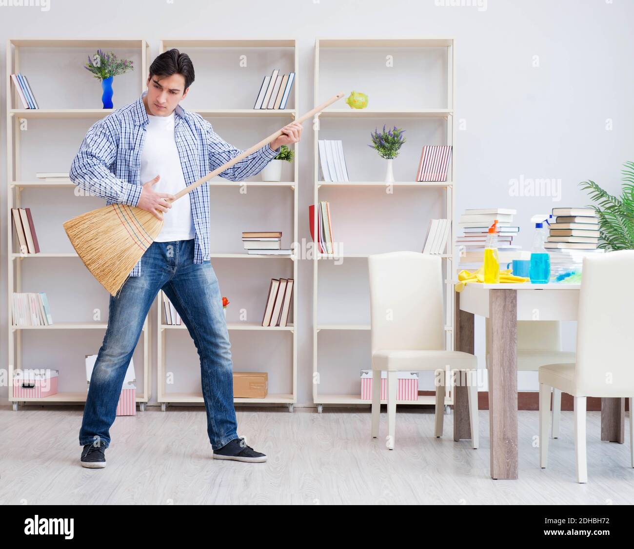 Man pretending vacuum cleaner hi-res stock photography and images - Alamy