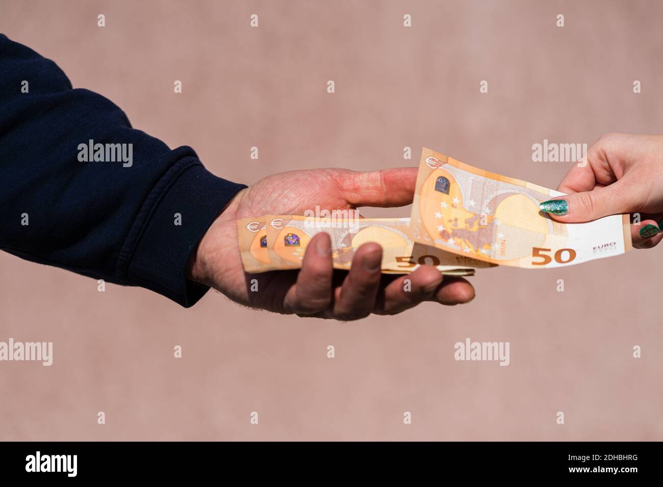 Hand giving money like bribe or tips or salary isolated, hard worked ...